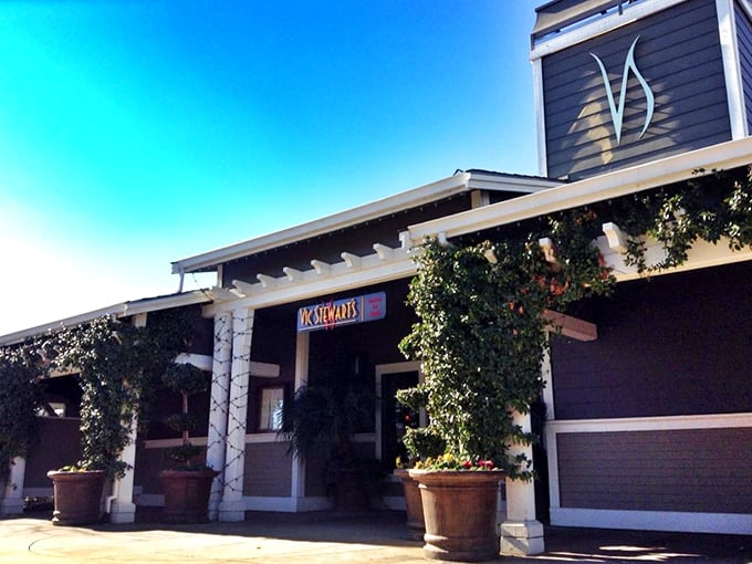 The sun-drenched exterior of Vic Stewart's beckons like an old friend who happens to make the best steaks in town. The warm tan building with its distinctive "VS" logo promises carnivorous delights within.