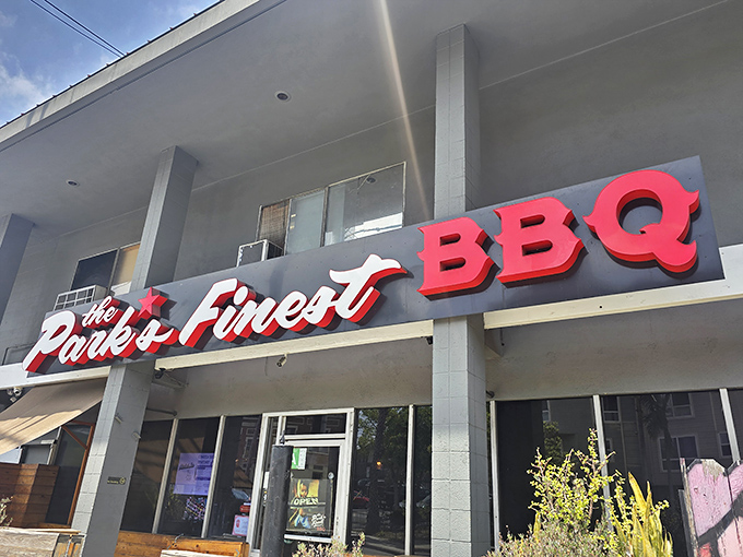 The bold red signage of The Park's Finest BBQ beckons like a beacon to hungry souls wandering Echo Park. No frills, just promises of smoky delights within.