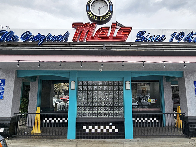 The neon sign at The Original Mels Diner glows like a beacon of comfort food, promising nostalgic flavors and that unmistakable diner hospitality.