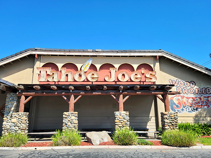 The mountain lodge architecture of Tahoe Joe's stands out in Fresno like a Sierra Nevada outpost, promising carnivorous delights within those rustic walls.