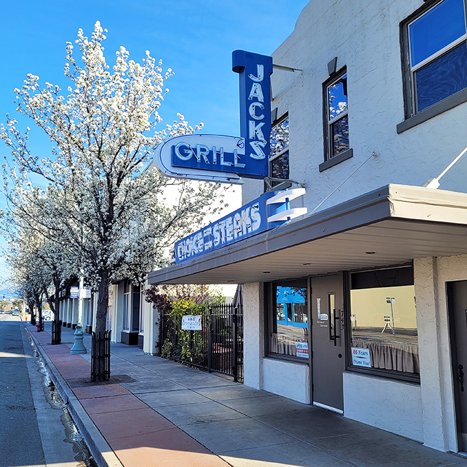 That vintage neon glow says everything about Jack's Grill &ndash; authentically timeless steakhouse magic awaits inside.