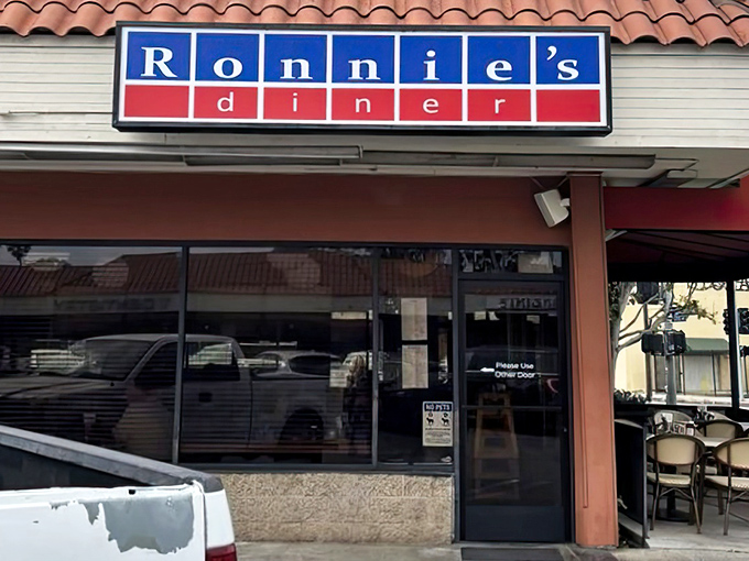 The unassuming blue and red sign promises no frills, just honest food &ndash; like finding a secret handshake in culinary form.