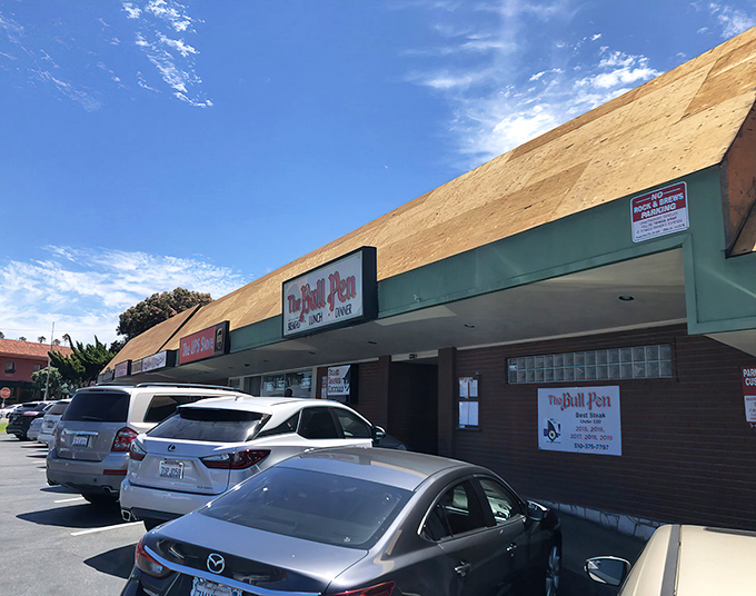The unassuming strip mall exterior of The Bull Pen hides a culinary time capsule within. Classic steakhouse magic doesn't always wear a fancy facade.