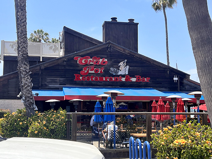 Palm trees frame this coastal gem where colorful umbrellas dot the patio &ndash; nature's way of saying "relax, you've found your seafood sanctuary."