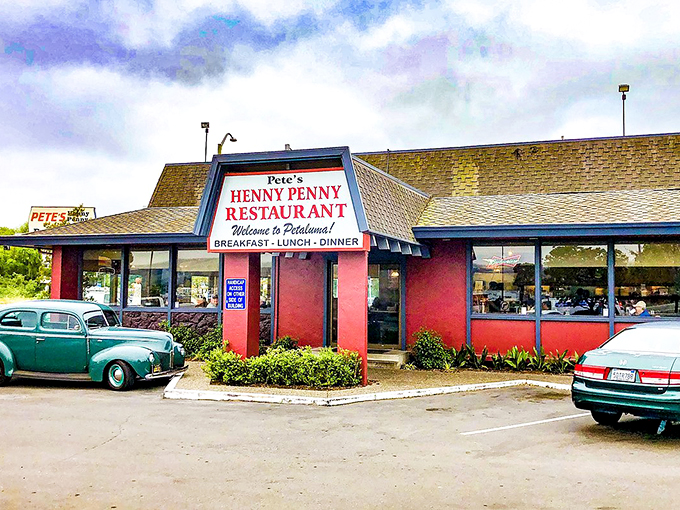 The unassuming pink exterior of Pete's Henny Penny stands like a time capsule of American diner culture, promising comfort food treasures within.