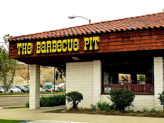 The unassuming exterior of The Barbecue Pit stands as a testament that culinary greatness doesn't need flashy signage&mdash;just decades of smoke-infused expertise.