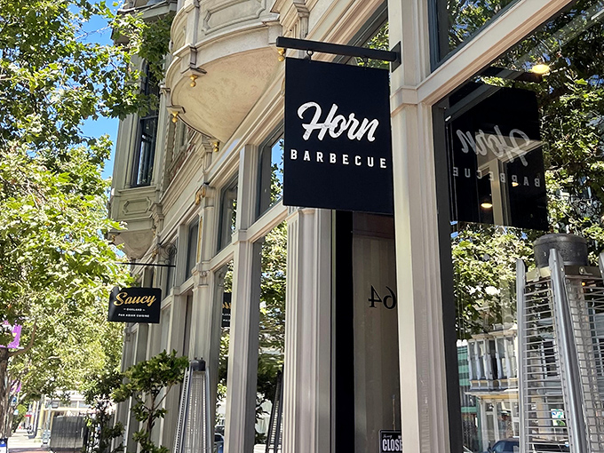 The striking longhorn mural on Horn Barbecue's exterior isn't just decoration&mdash;it's a promise of the primal, smoky delights waiting inside this Oakland treasure.