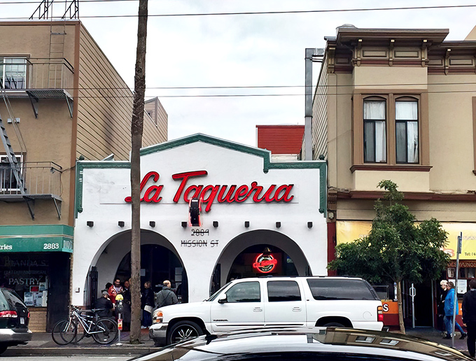 The iconic white facade with that red script sign is like a beacon of hope for burrito lovers everywhere. Mission District's culinary North Star.
