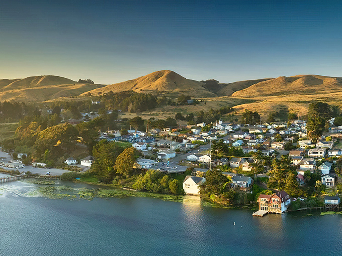 Golden hour transforms Bodega Bay into a watercolor painting come to life, where coastal homes perch between land and sea like they're still making up their mind.