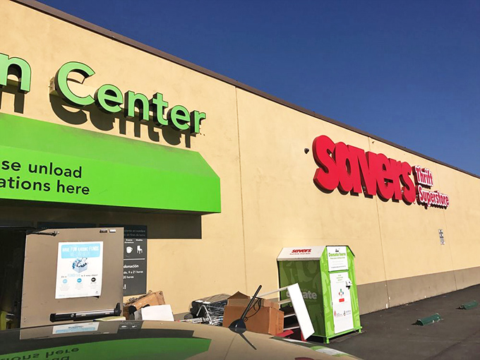 The iconic green and red Savers sign beckons bargain hunters like a retail lighthouse, promising treasures within those beige walls.