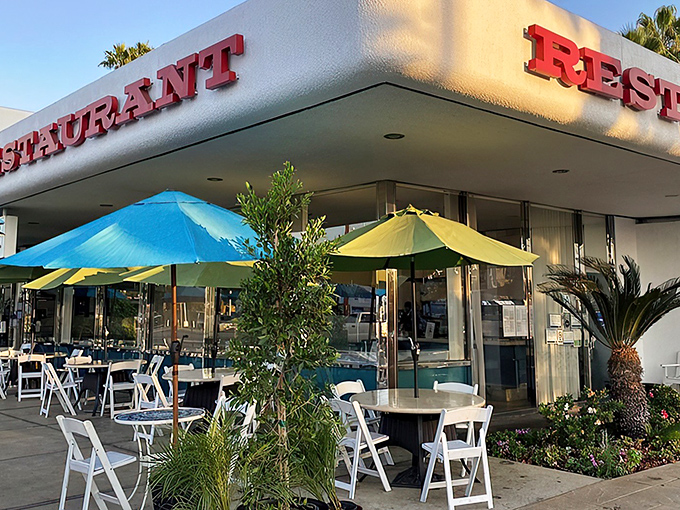 The classic red lettering and cheerful patio umbrellas promise what every great diner should: comfort food served with a side of nostalgia.