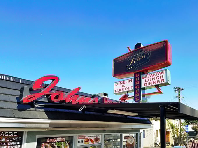 That iconic red neon sign has been guiding hungry souls to pastrami paradise since before kale became California's unofficial mascot.