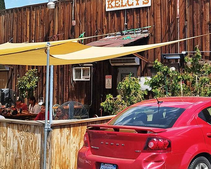 The iconic yellow "CAFE" sign above Kelcy's wooden facade isn't just advertising – it's a beacon of hope for hungry travelers and locals alike.