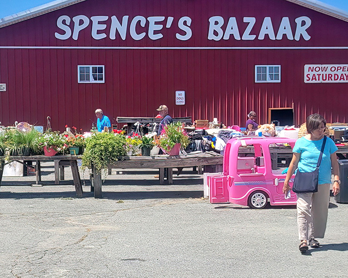 The iconic red barn of Spence's Bazaar comes alive with outdoor vendors, from fresh plants to a pink kiddie car awaiting its next adventure.