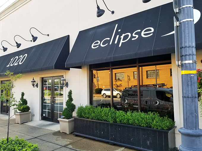 Eclipse Bistro's elegant black awnings and crisp white facade create the perfect understatement &ndash; culinary magic often hides in the most unassuming packages.