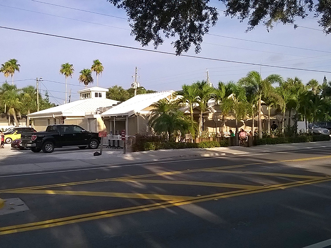 The classic Florida beach architecture of Guppy's welcomes hungry visitors with its white roof and lush tropical landscaping&mdash;a postcard-perfect coastal dining destination.