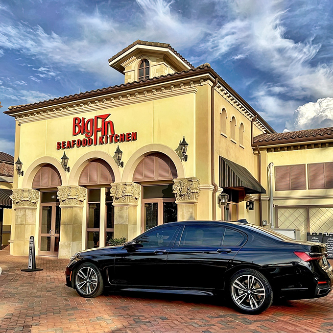 The Mediterranean-inspired fa&ccedil;ade of Big Fin Seafood beckons like a coastal oasis amid Orlando's sea of theme park dining options.