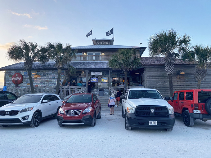 The weathered wooden exterior of Peg Leg Pete's stands like a salty sea captain against the Florida sky, palm trees swaying as if keeping time to a Jimmy Buffett tune.