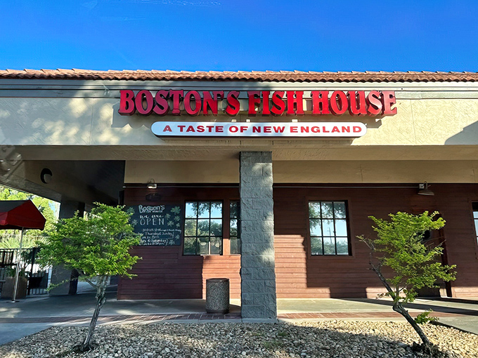 The bright red sign of Boston's Fish House stands out against the Florida sky, promising New England treasures in the Sunshine State.