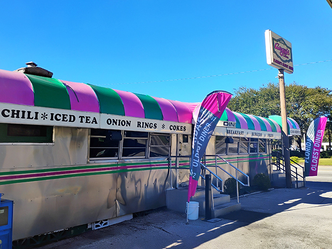 The pink and green striped awning of Angel's Dining Car isn't just eye-catching&mdash;it's a beacon of hope for hungry travelers who know what culinary treasures await inside.