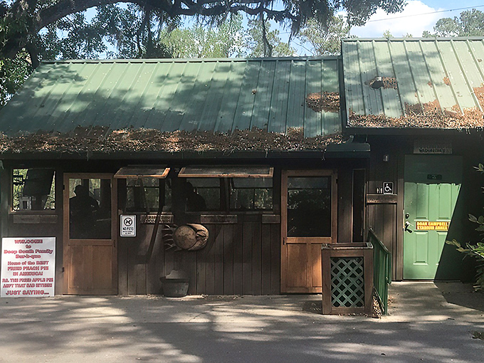 The humble green-roofed cabin with wooden walls might not scream "culinary destination," but your nose will know better the moment you step out of the car.