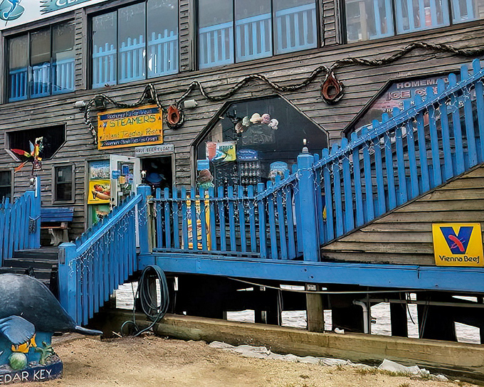 The weathered wooden exterior with its bright blue staircase isn't trying to impress anyone&mdash;until you taste what's inside. Cedar Key authenticity at its finest.
