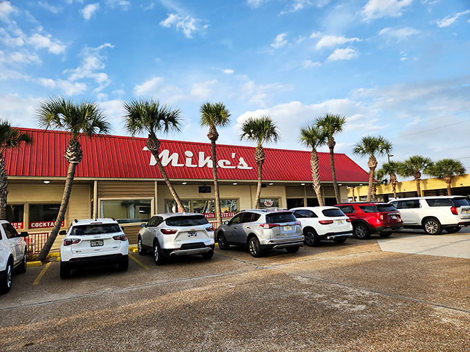 The iconic red roof of Mike's Cafe beckons seafood lovers like a lighthouse guiding hungry sailors home to port.