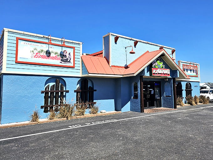 The turquoise blue exterior with coral roof isn't just Florida architecture&mdash;it's a promise of the coastal flavor fiesta waiting inside.