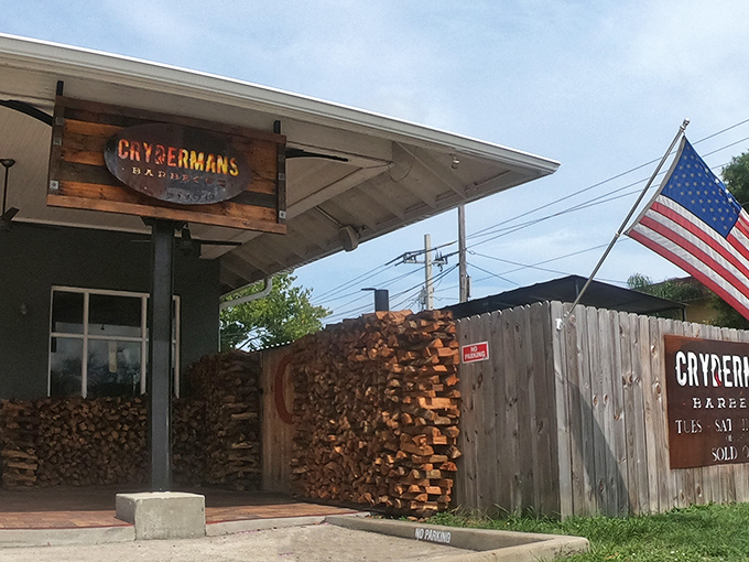 Stacked oak logs aren't just decoration—they're the aromatic fuel behind that mouthwatering brisket you're about to devour.