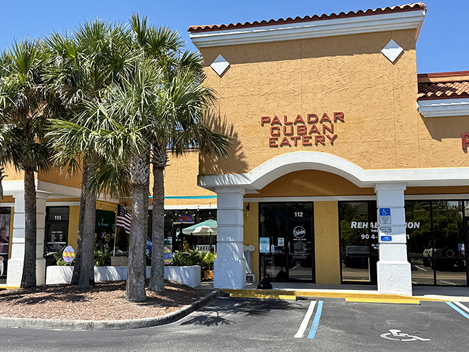 Palm trees stand guard outside this sunny yellow stucco building, as if whispering, "Trust us, the Cuban sandwiches inside are worth the trip."
