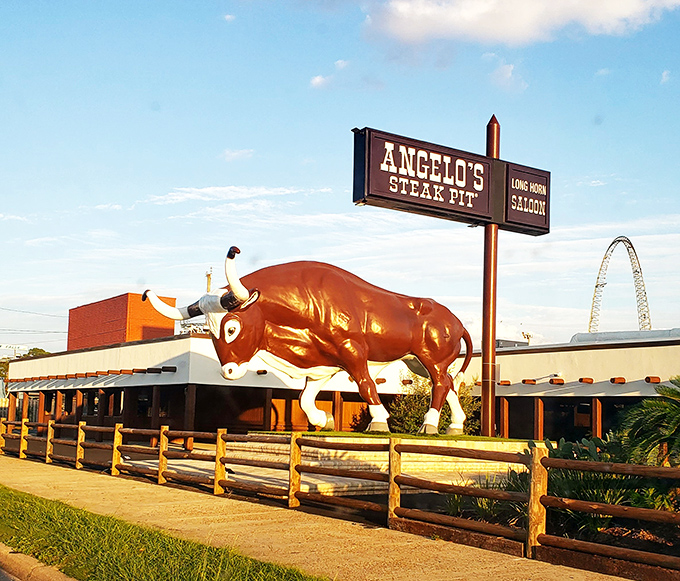 The legendary bull statue stands guard outside Angelo's Steak Pit, a beacon for meat lovers that's as much a Panama City Beach landmark as any sandy shore.