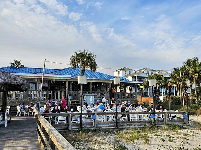 Where memories are made: The bustling deck at Blue Parrot fills with diners seeking that perfect combination of Gulf views and fresh seafood.