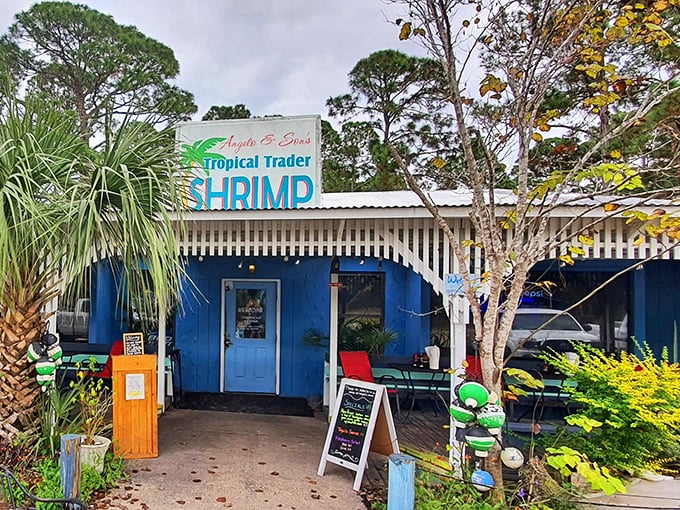 The blue facade of Tropical Trader Shrimp Co. stands out like a delicious mirage among the palm trees. Florida coastal charm doesn't get more authentic than this.