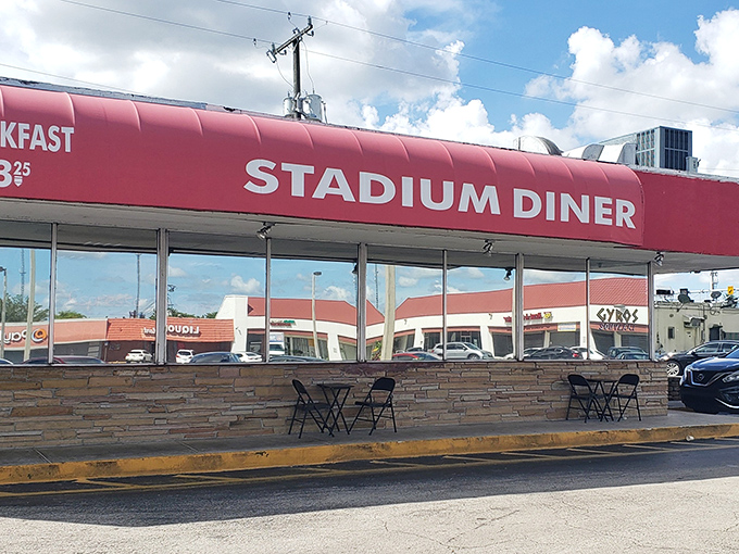 The iconic red awning of Stadium Diner stands out like a beacon for hungry Miamians, promising comfort food that transcends trendy culinary fads.