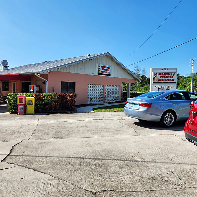 The unassuming pink exterior of Sebastian's Roadside Restaurant proves once again that culinary treasures often hide in plain sight.
