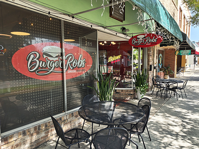 The bright red exterior of BurgerRobs stands out like a beacon for burger lovers, promising smashed patty perfection inside.