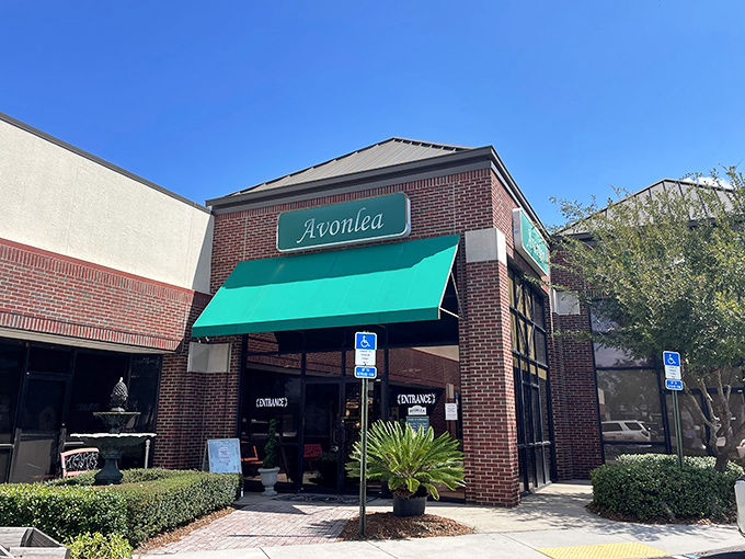 Welcome to vintage paradise! Avonlea's inviting entrance with its distinctive green awning beckons bargain hunters and nostalgia seekers alike. The adventure begins right through those doors.