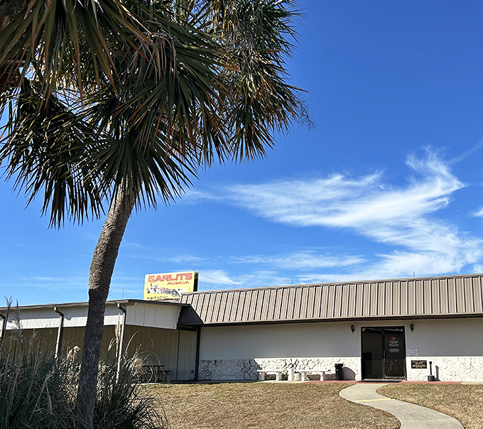 The entrance to speed paradise. That iconic sign and unassuming metal building house more automotive history than most Smithsonian wings.