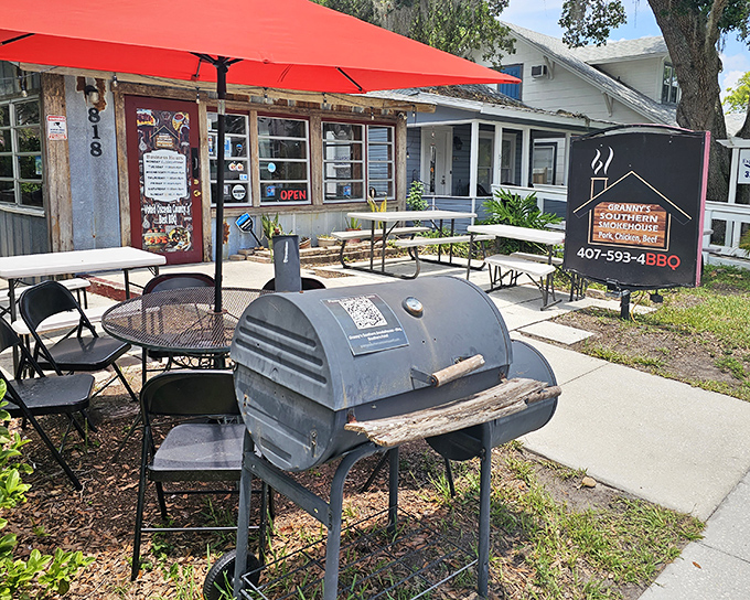 A bright red umbrella welcomes you like an old friend to this unassuming BBQ sanctuary. The smoker out front isn't just equipment&mdash;it's a promise.