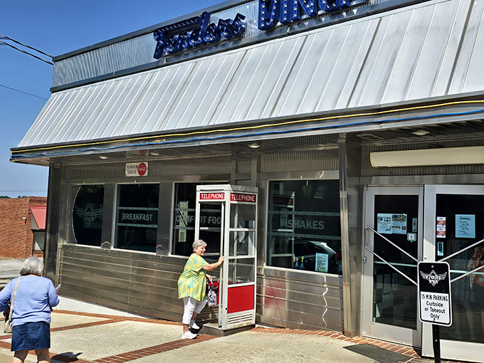The iconic blue sign beckons hungry travelers like a retro lighthouse guiding you to comfort food shores.
