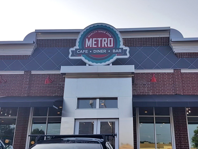 The iconic Metro Cafe Diner sign welcomes hungry souls like a beacon of hope in a world of drive-thru disappointments. Comfort food paradise awaits!