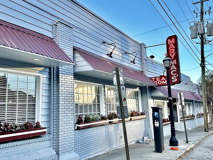 The iconic blue-and-red façade of Mary Mac's stands like a beacon of Southern comfort on an Atlanta street corner, promising delicious revelations within.