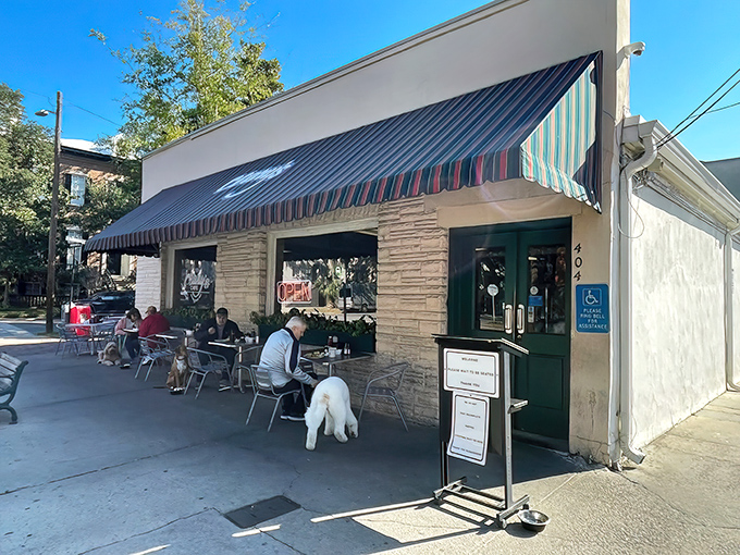 The colorful striped awning of Clary's beckons like a breakfast lighthouse in Savannah's historic district, complete with pet-friendly outdoor seating.