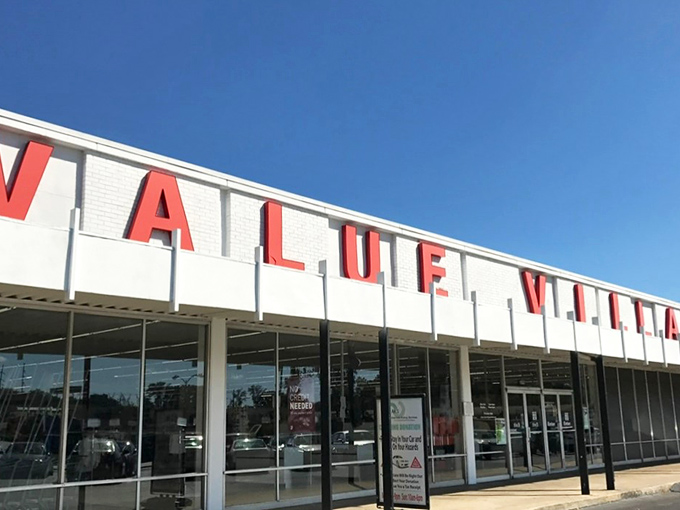 The glowing red sign beckons like a lighthouse for bargain hunters. Value Village stands ready to transform your wallet's frown upside down.
