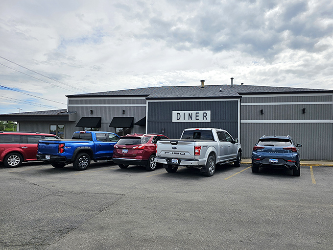 The unassuming exterior of Bartonville Diner stands like a blue-gray beacon of breakfast hope. No fancy frills, just the promise of honest-to-goodness comfort food inside.