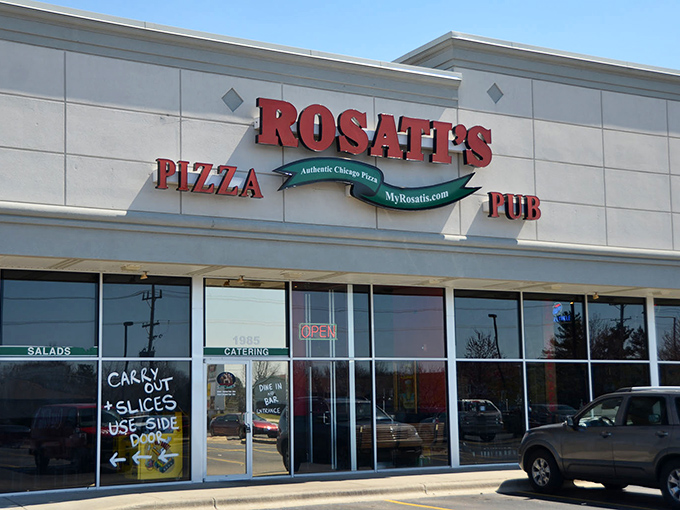The iconic red Rosati's sign beckons hungry travelers like a lighthouse guiding ships to safe harbor. Chicago-style pizza paradise awaits inside these unassuming walls.
