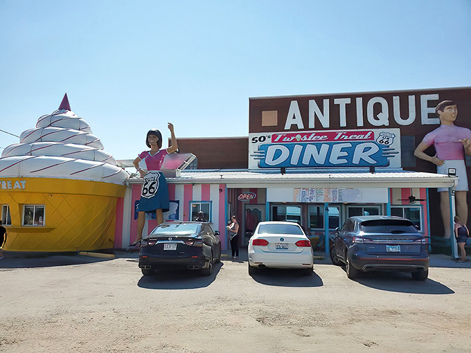 Route 66 nostalgia comes alive at this roadside time capsule, where the giant twisty ice cream cone and vintage diner aesthetics make Instagram filters completely unnecessary.