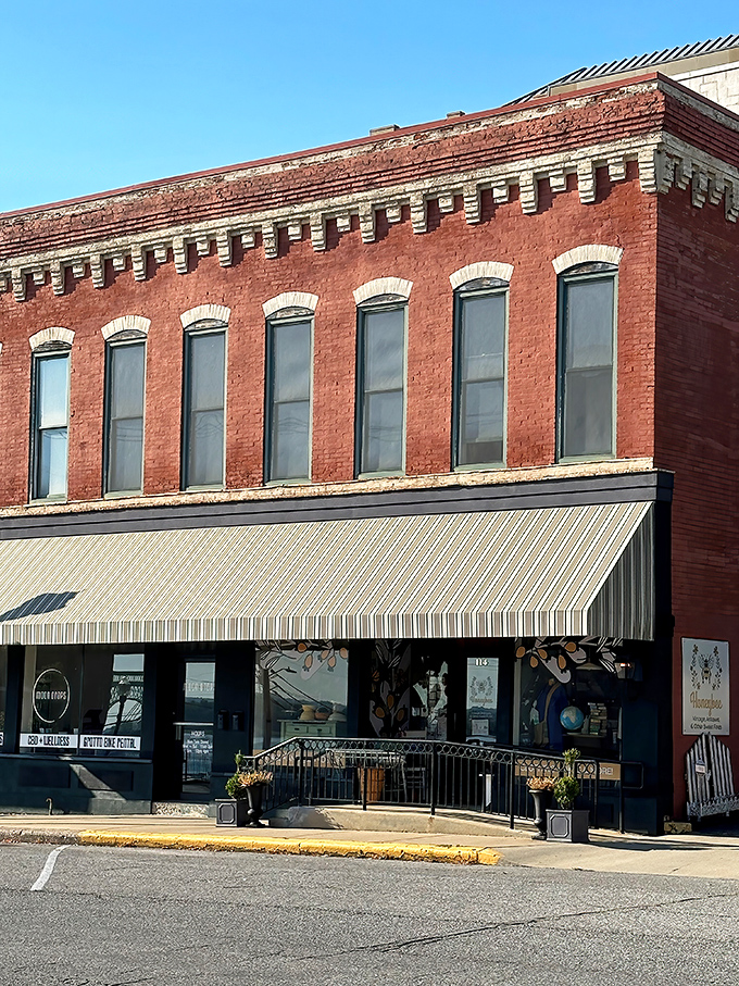 The historic brick fa&ccedil;ade of Honeybee Vintage stands proudly on Alton's main street, its striped awning like a welcome flag for treasure hunters.