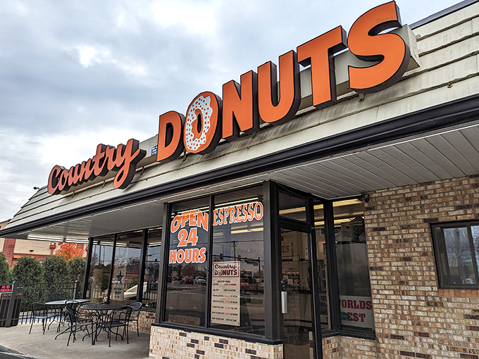 The iconic orange signage of Country Donuts glows like a beacon of hope for the sugar-deprived. Open 24 hours because donut emergencies respect no clock.