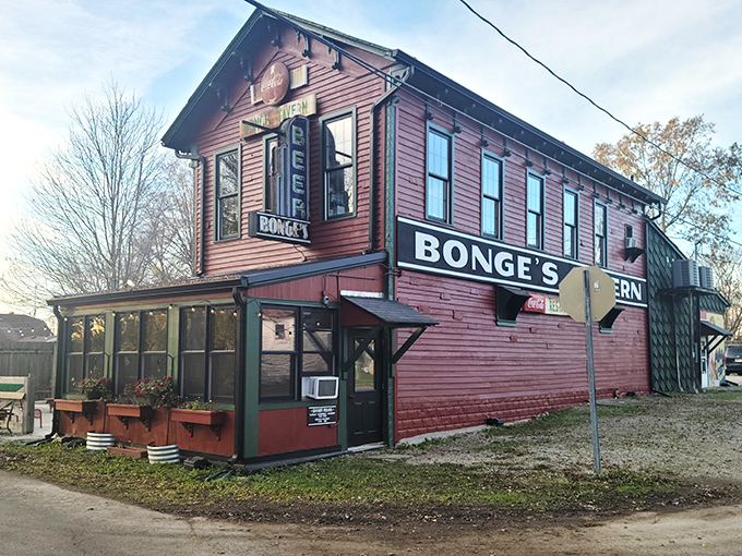 The unassuming burgundy exterior of Bonge's Tavern stands like a culinary lighthouse in the Indiana countryside, beckoning hungry travelers from miles around.